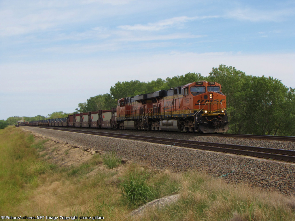 BNSF 7266 heads across the bridge over the Kansas river,
